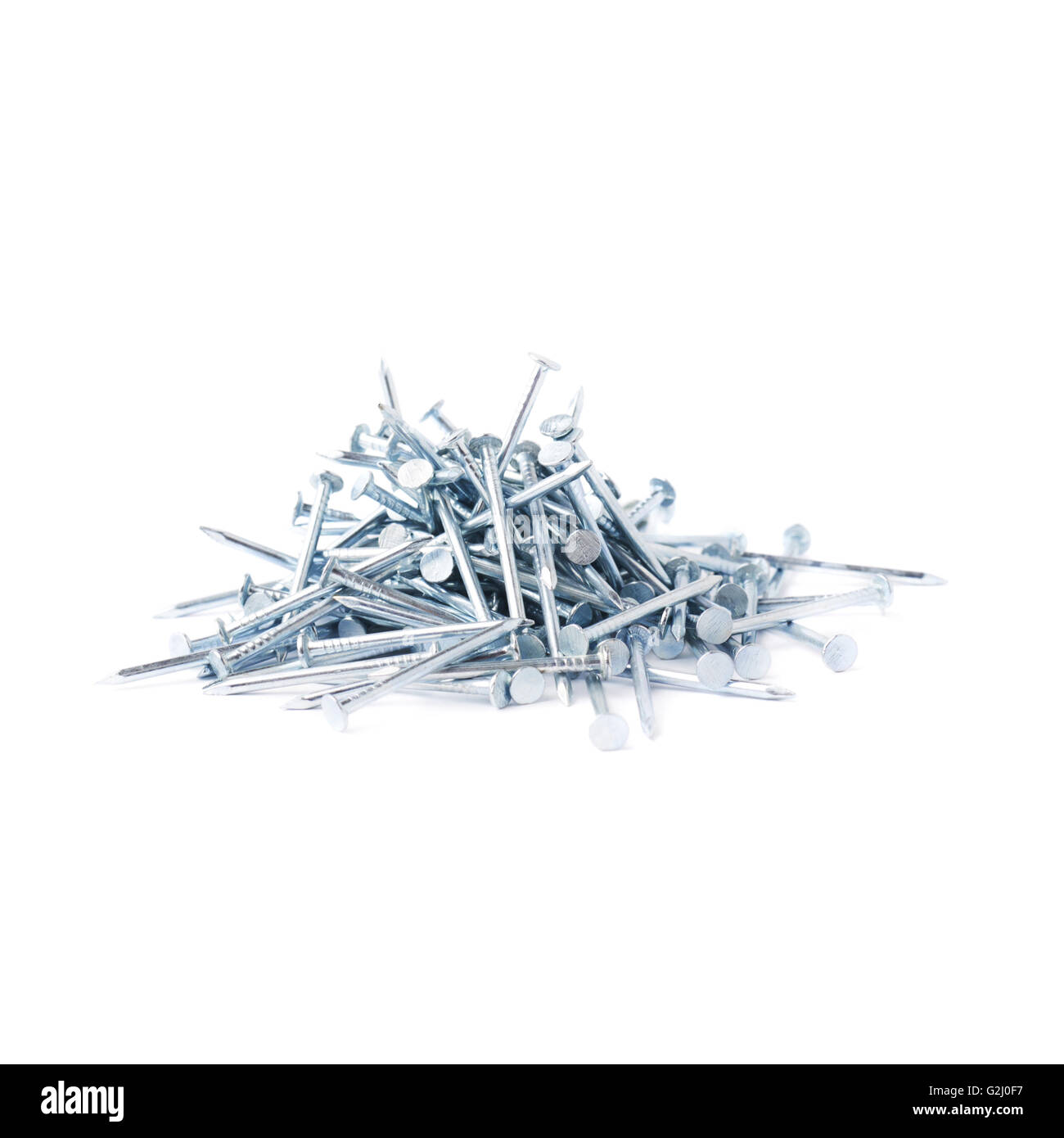 Pile of nails isolated over white background Stock Photo - Alamy