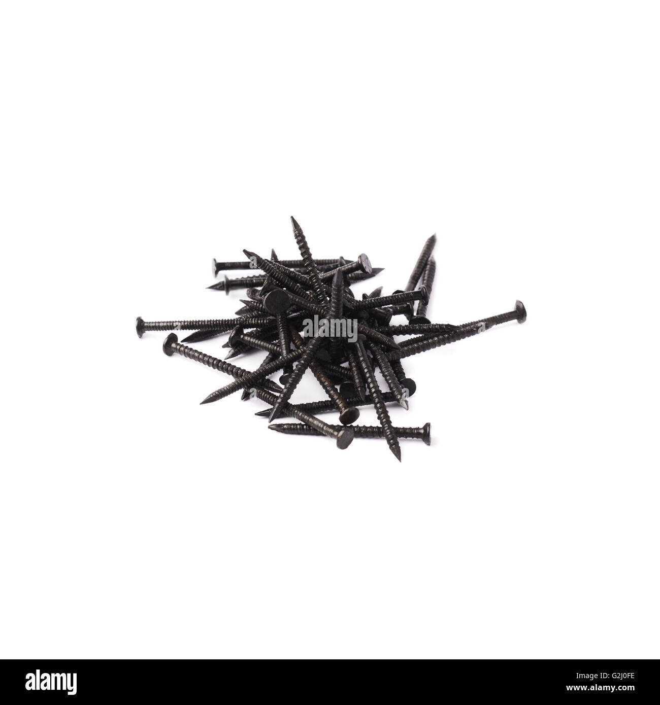 Pile of nails isolated over white background Stock Photo - Alamy