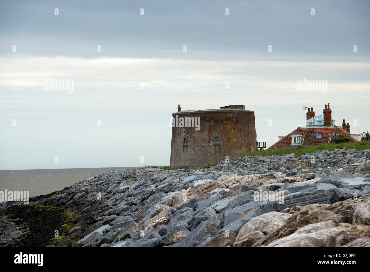 Rock armour protecting a Martello Tower and residential properties from ...