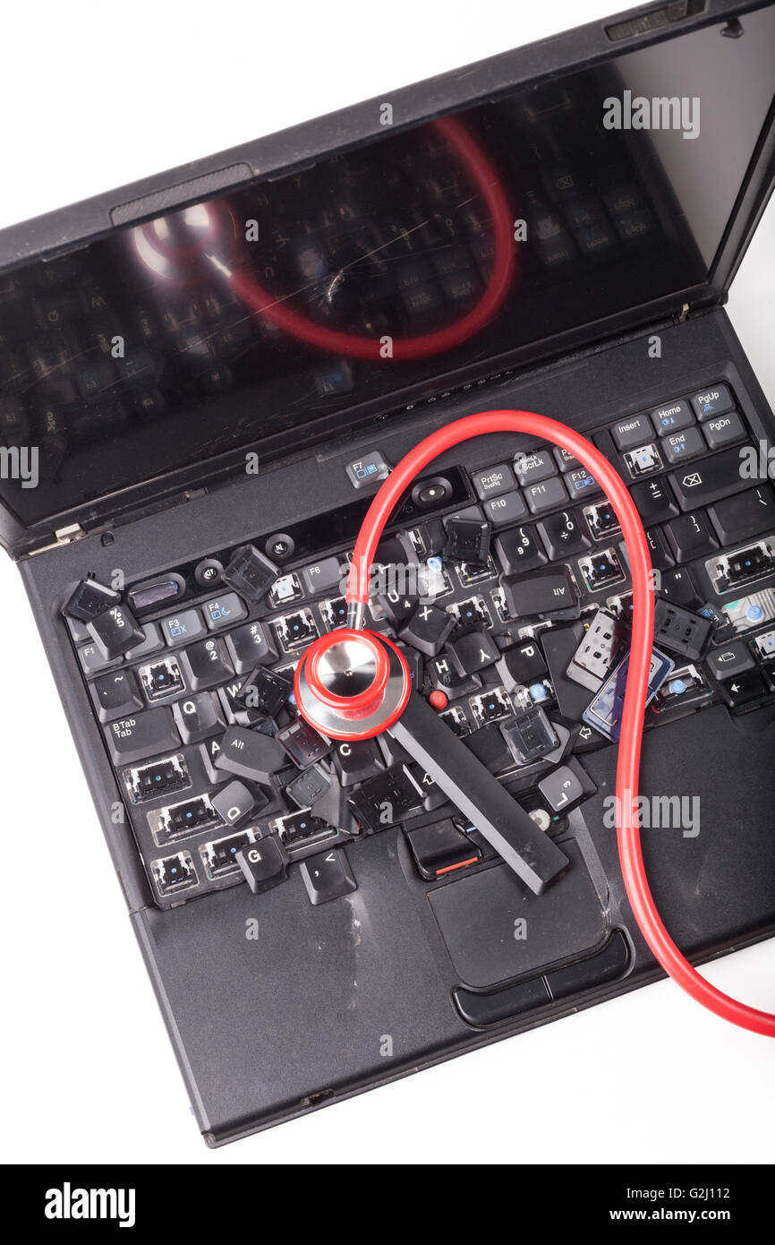 Broken black laptop with destroyed keyboard and smashed monitor with ...