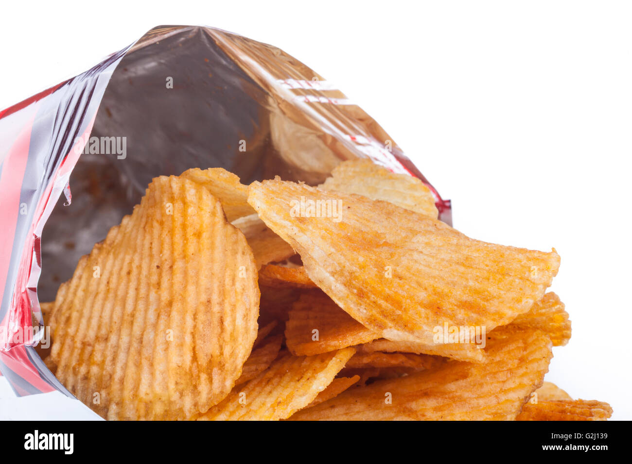 Potato ships pouring out of bag isolated on white background Stock ...
