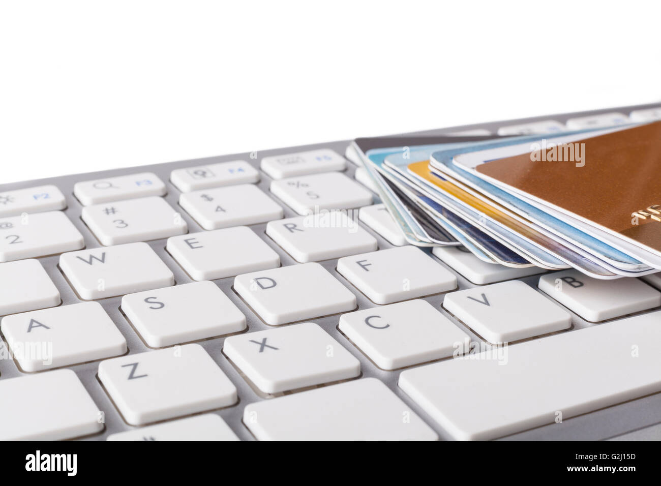 Multiple credit cards on computer keyboard on white background Stock ...
