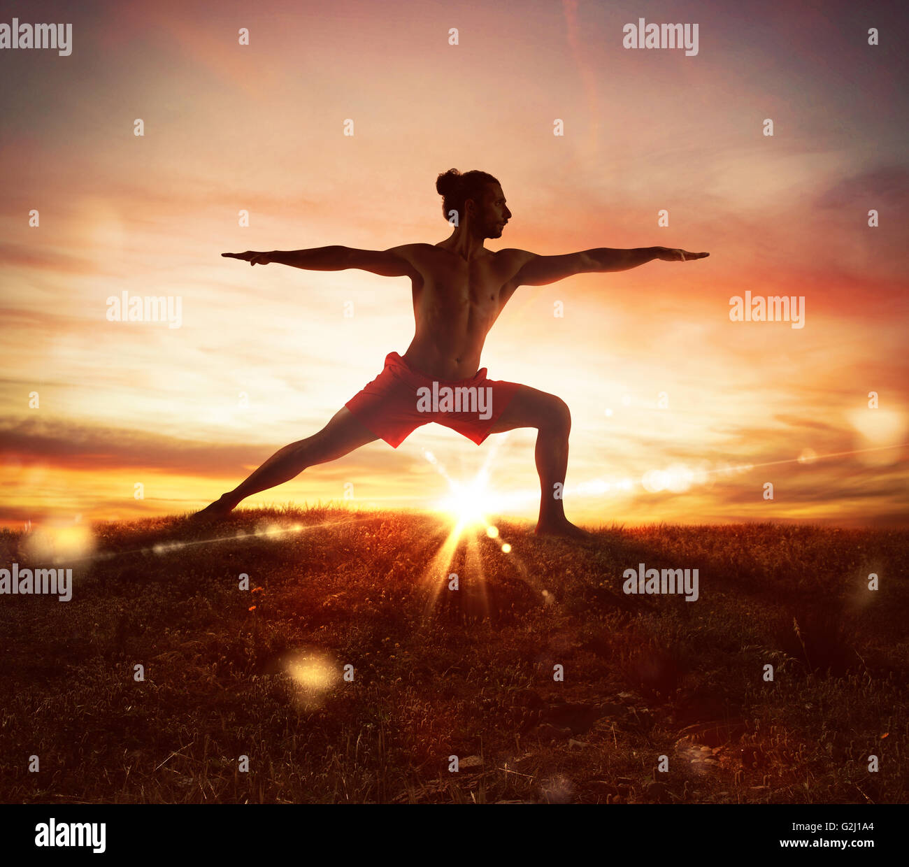 Yoga at sunset Stock Photo - Alamy