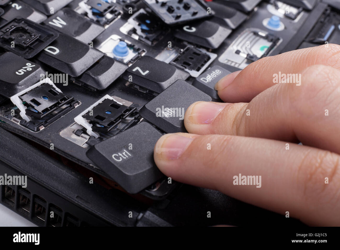 Fingers on alt crtl delete keys on broken laptop keyboard Stock Photo ...