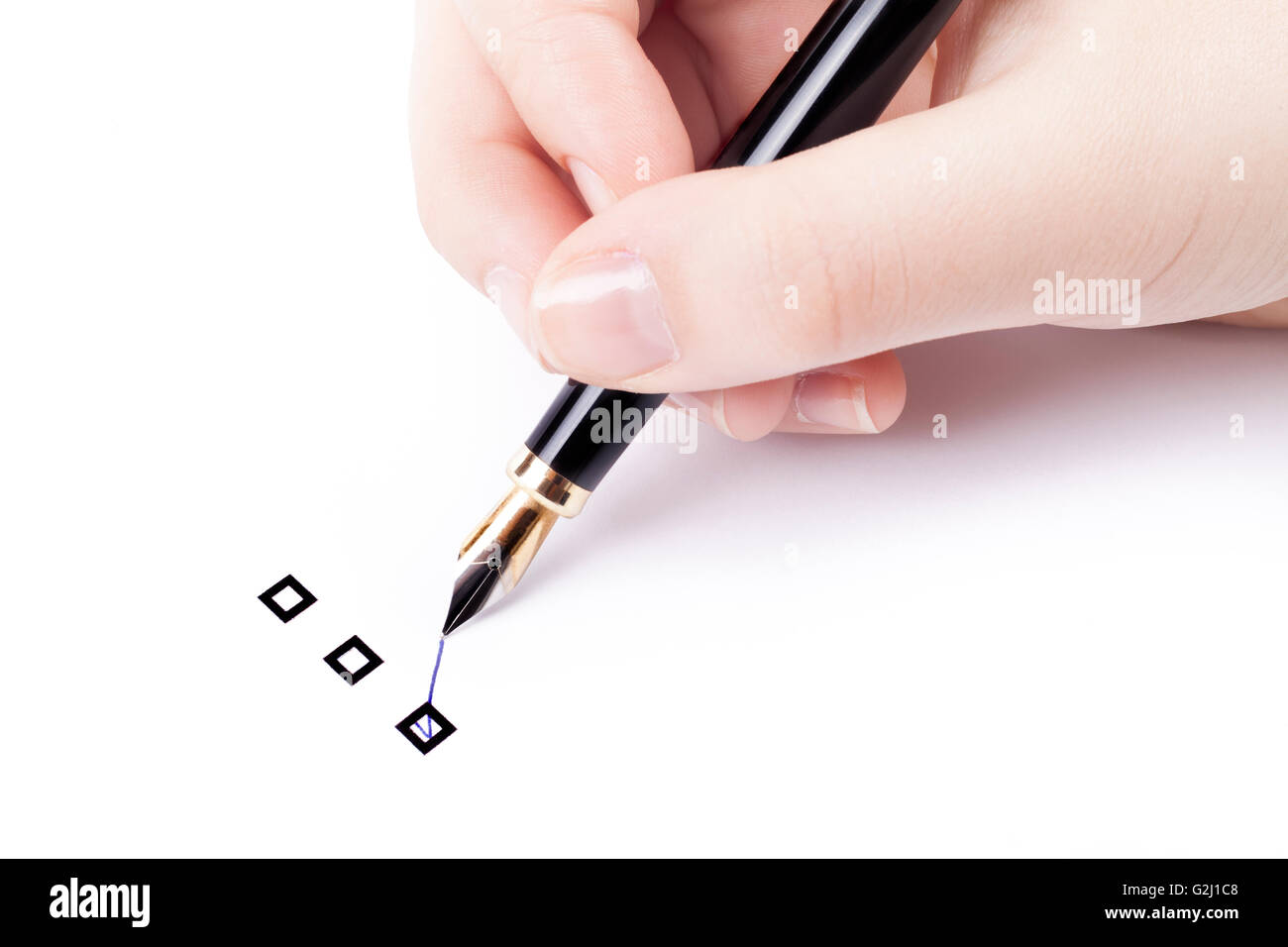 Hand Marking lower checkbox with blue fountain pen Stock Photo - Alamy