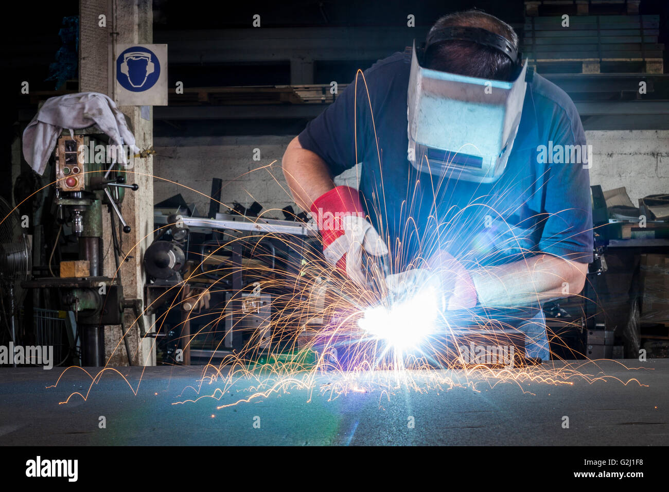 Metal welding in steel workshop with sparks and bright light Stock ...