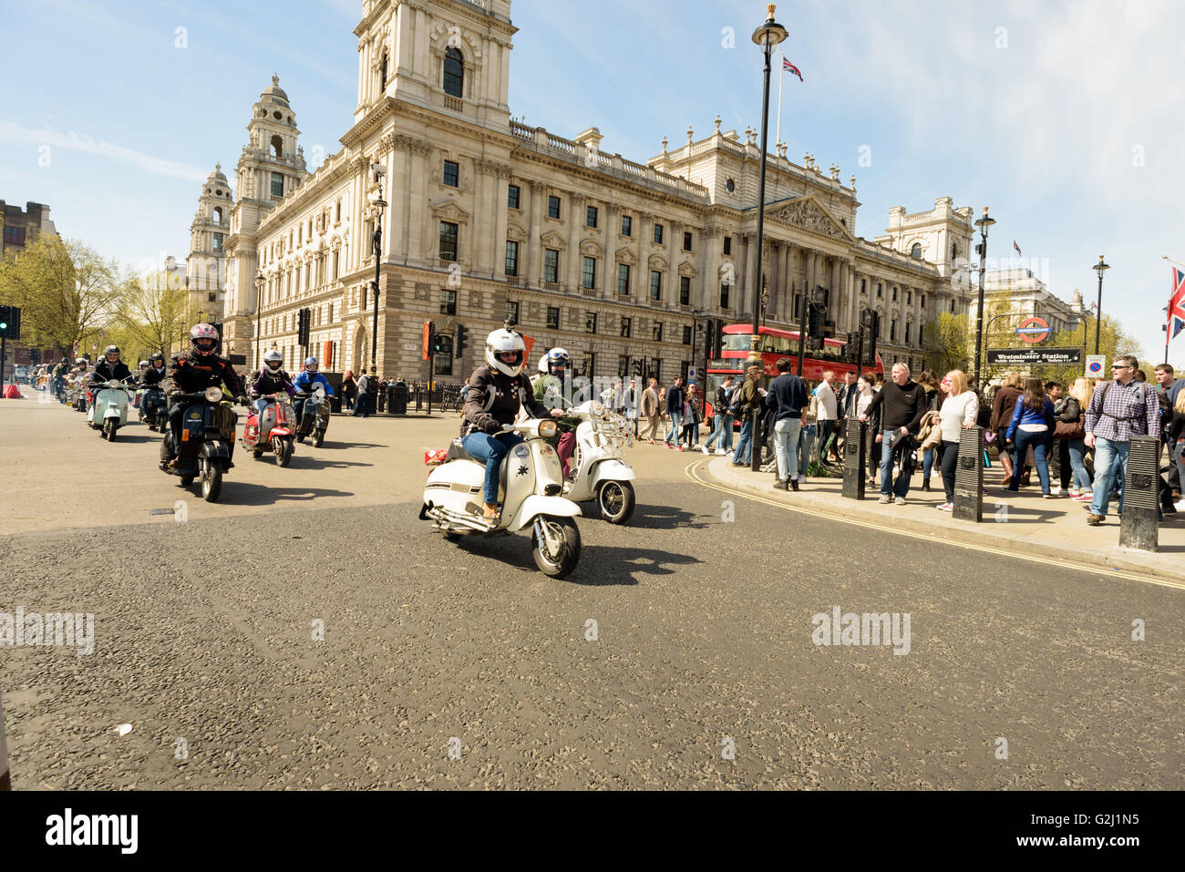 Mods riding their scooters through Parliament Square for the London to ...