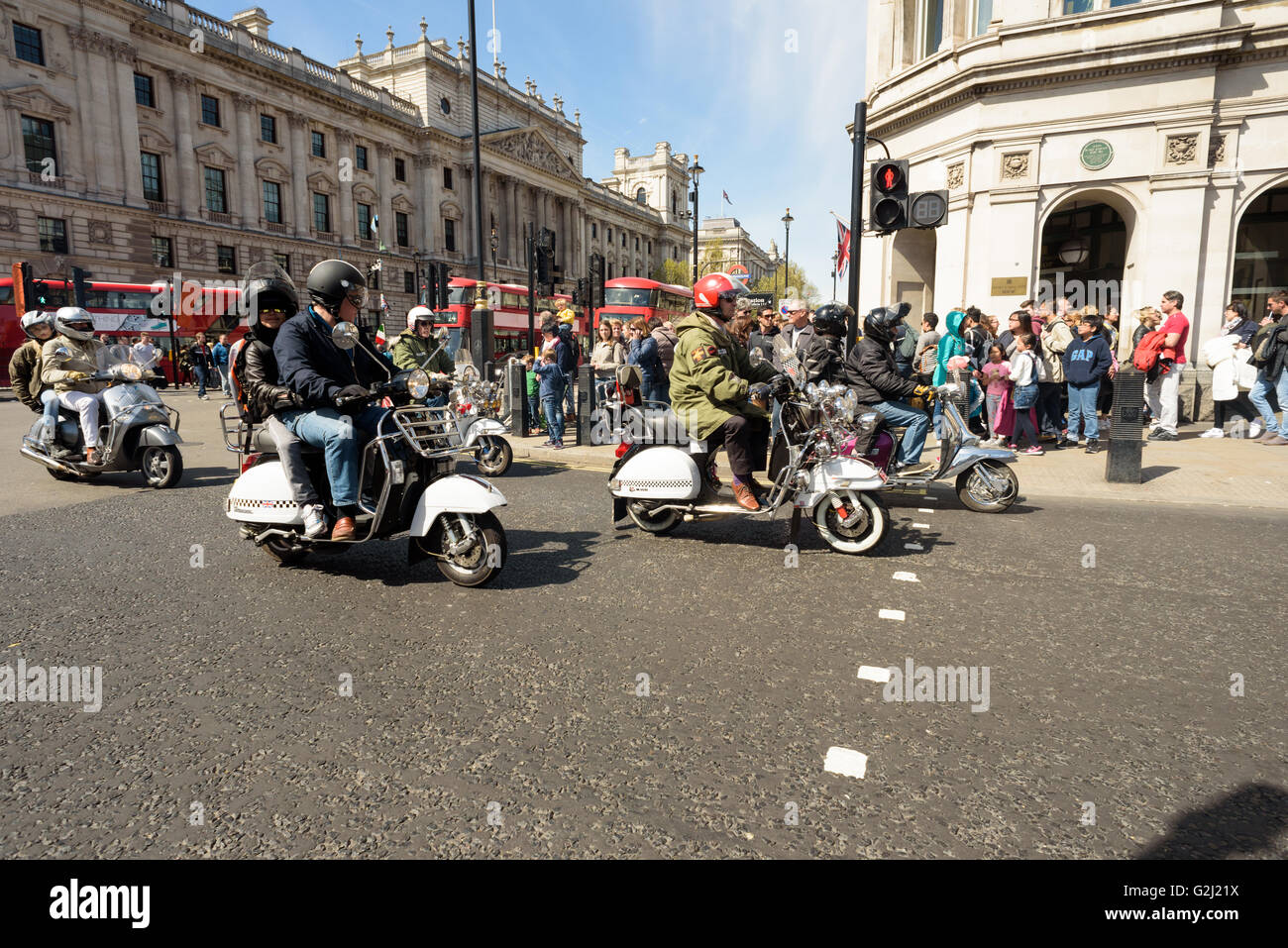 Mods riding their scooters through Parliament Square for the London to ...
