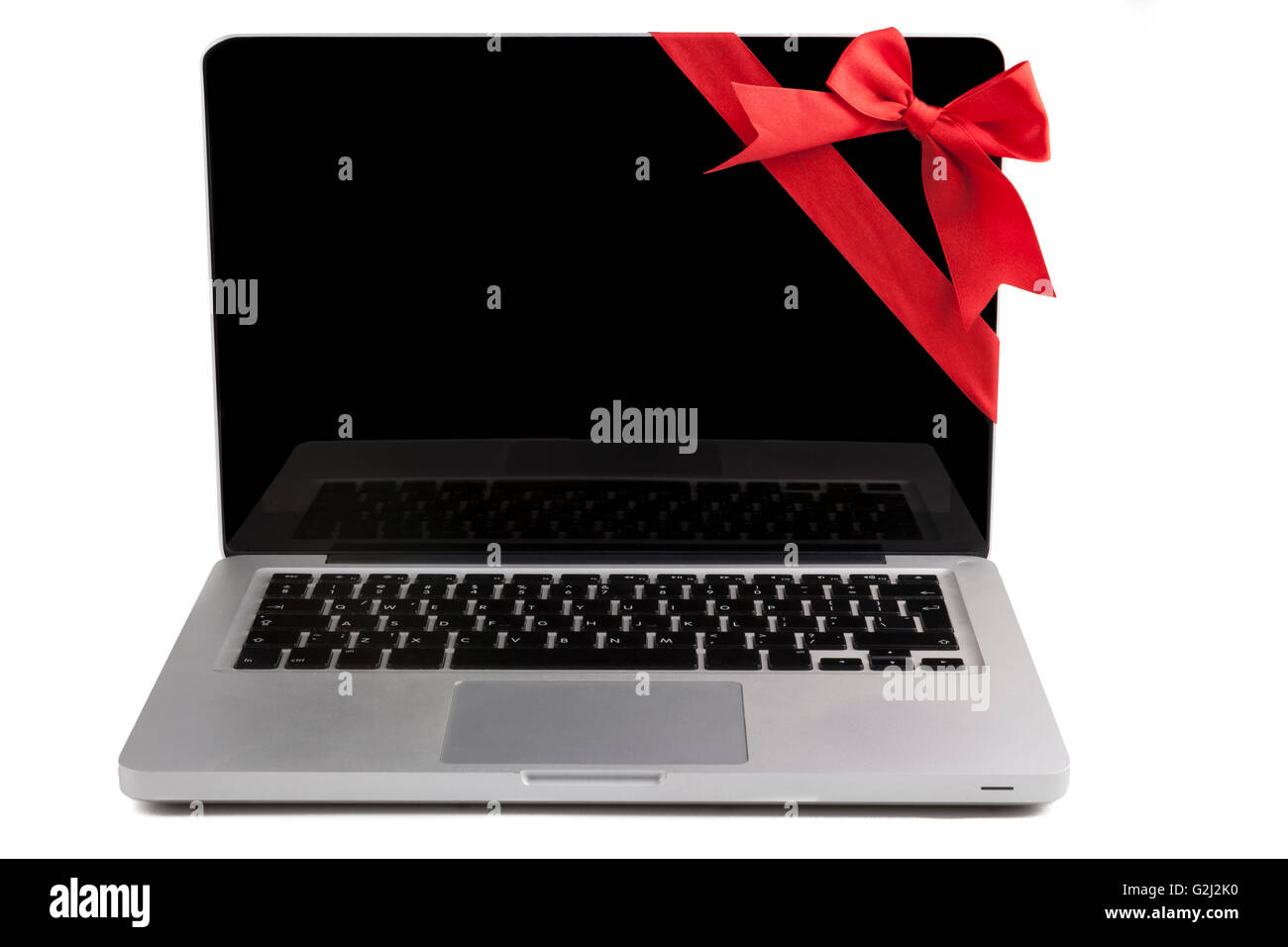 Silver colo computer with black keyboard and blank screen rapped with ...