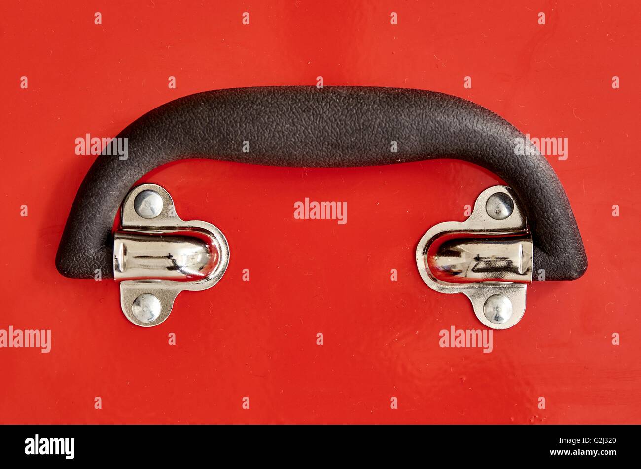 A close up photo of a tool box carry handle Stock Photo - Alamy