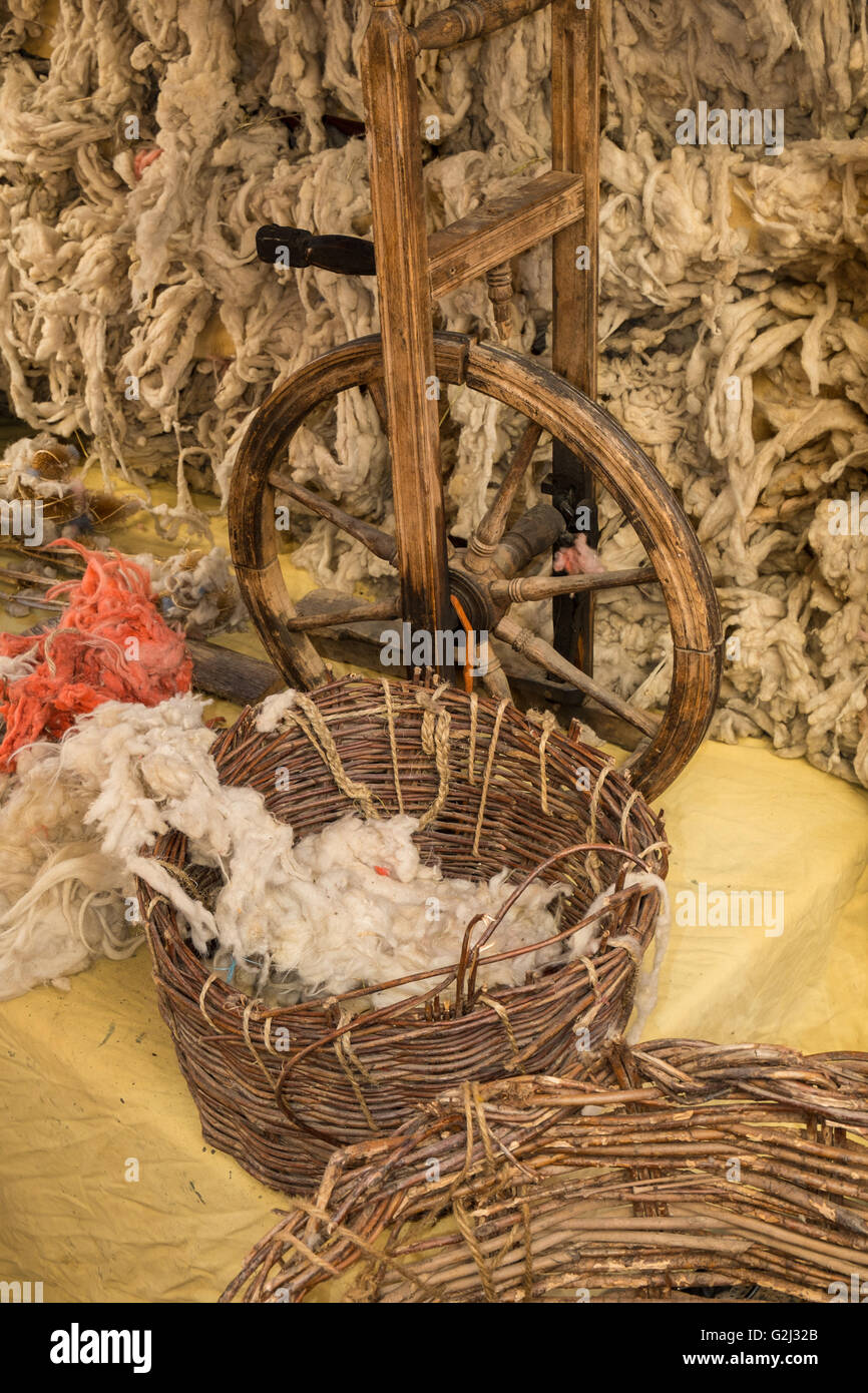 Old distaff surrounded by piles of raw wool Stock Photo - Alamy
