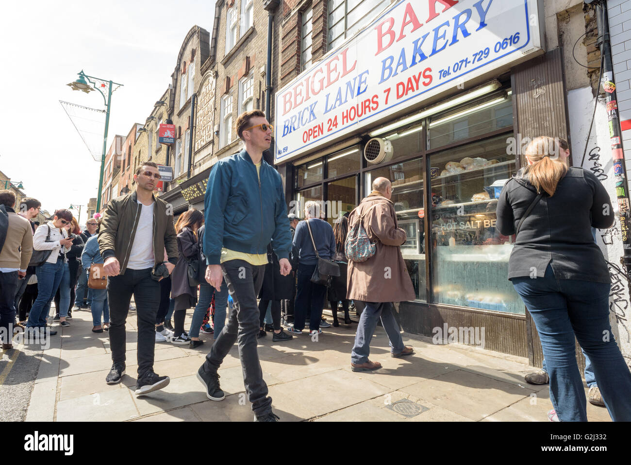 Members of the public walking outside a Beigel Shop in the famous Brick ...
