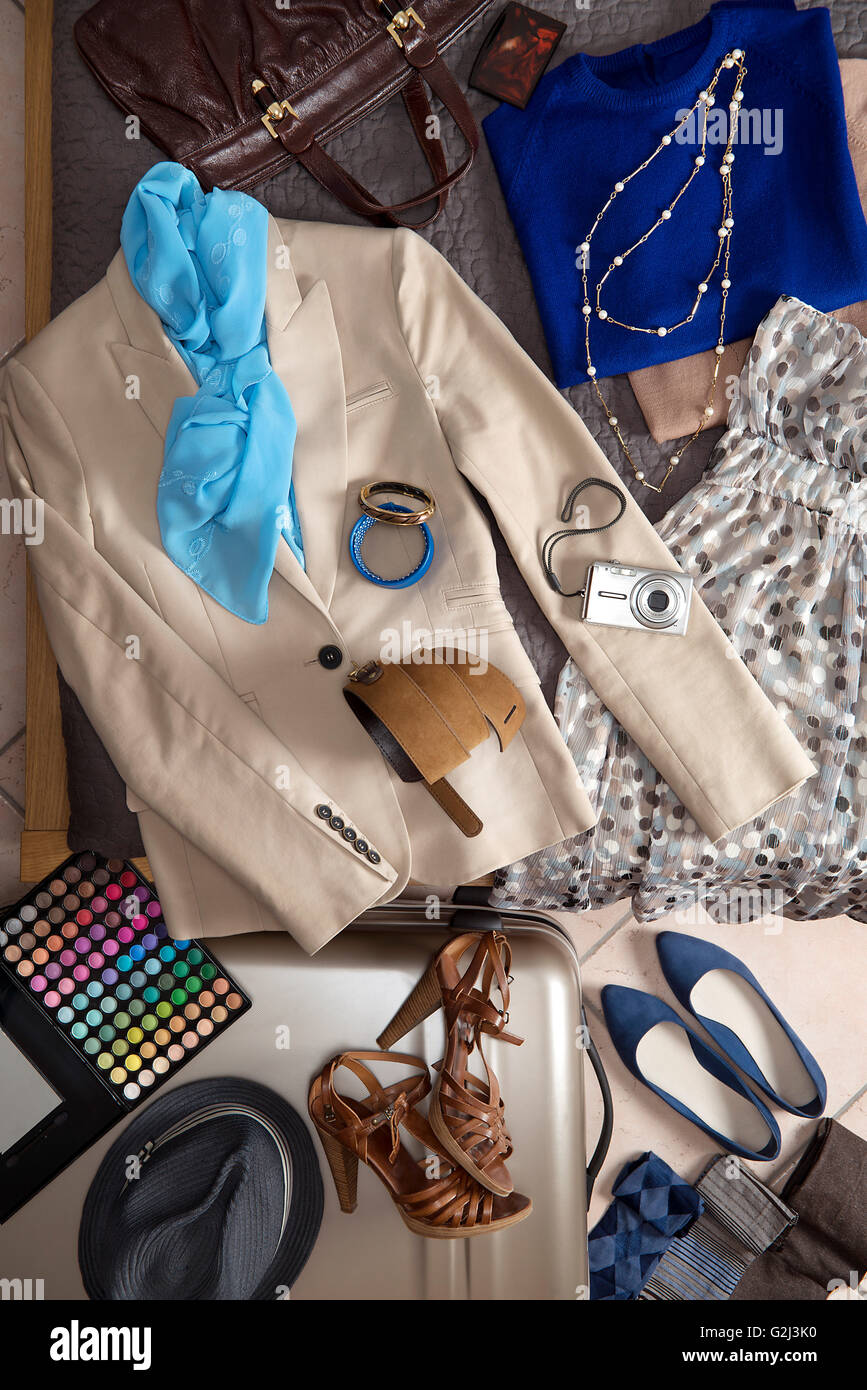 Preparing to Pack Luggage with Clothes and Accessories Spread out on ...