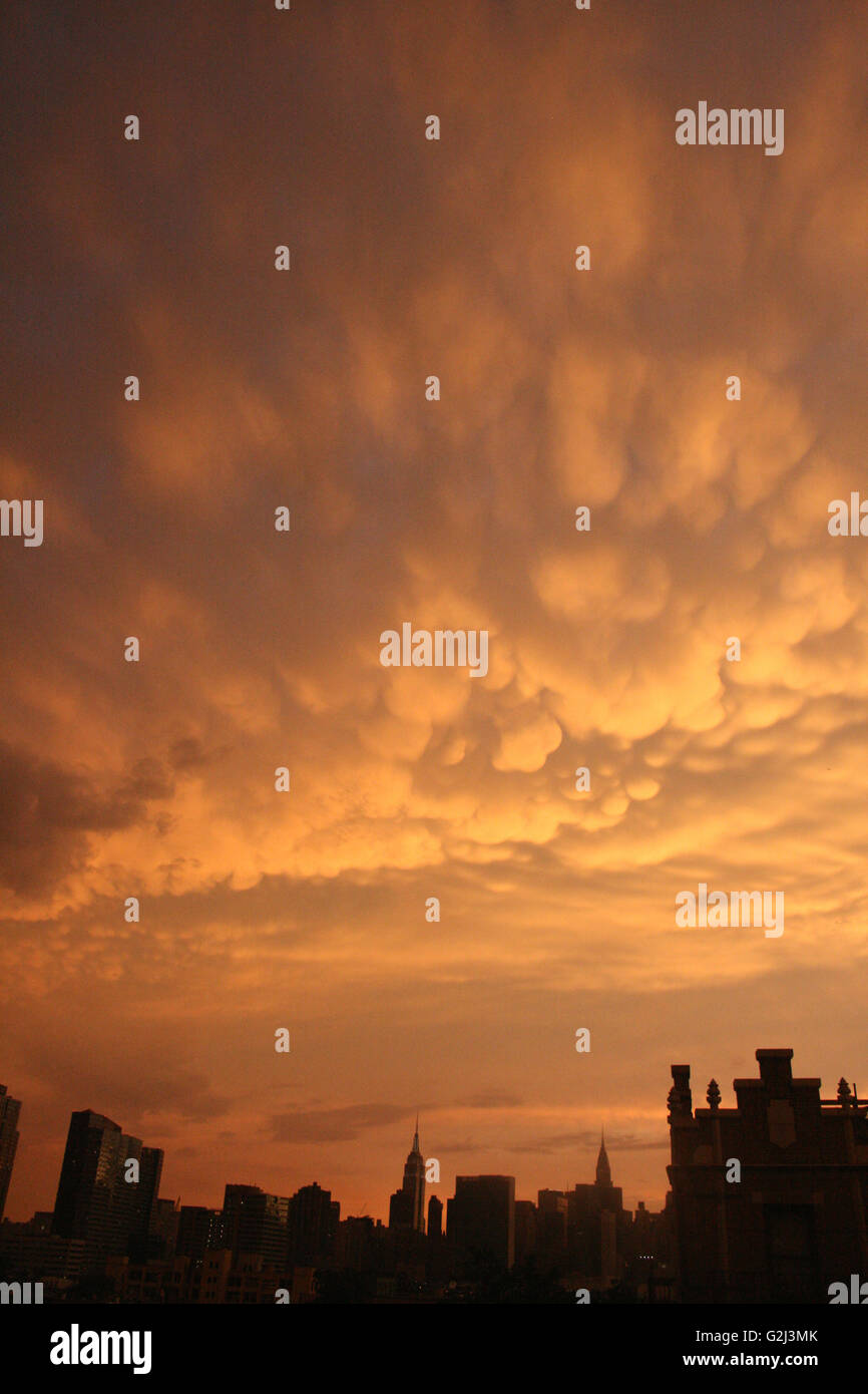 Orange Clouds in Sky Above NYC Stock Photo - Alamy