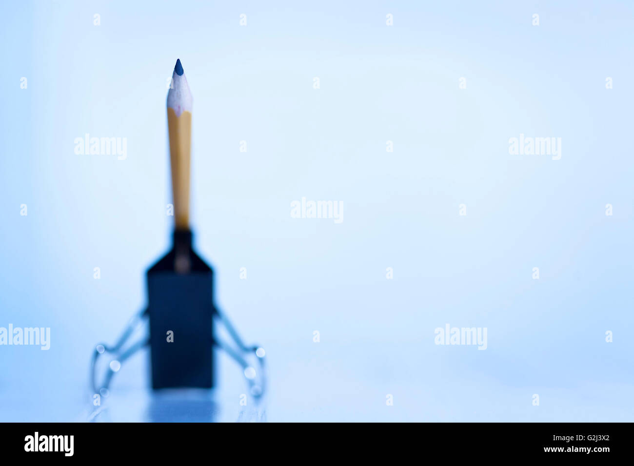 Pencil Propped Up on Metal Clip Stock Photo - Alamy