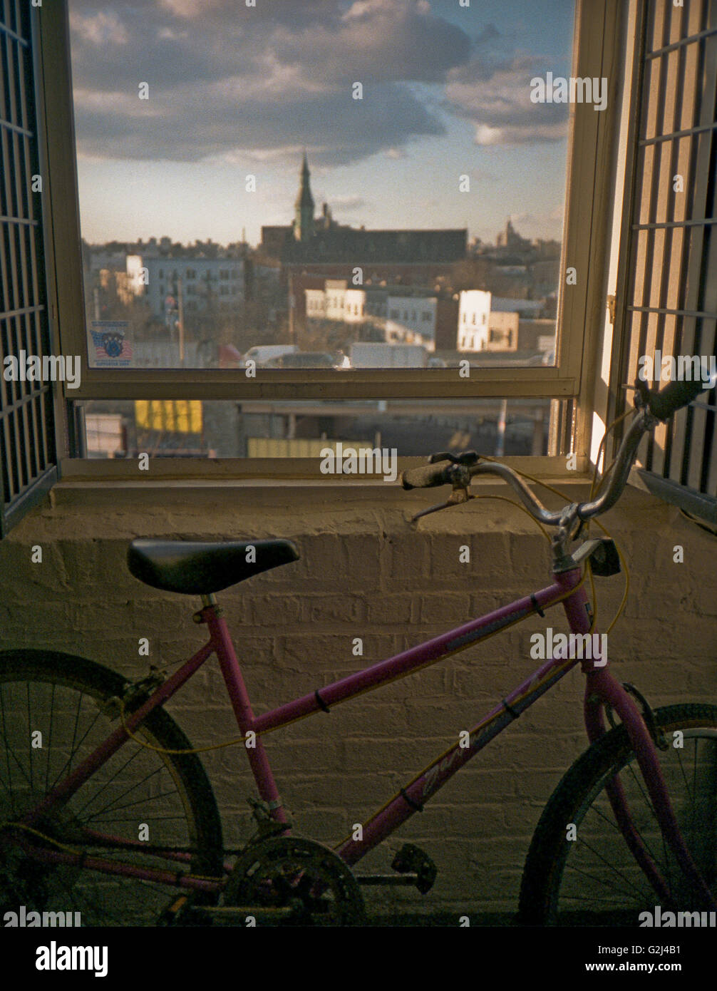 Bicycle by Window Stock Photo - Alamy