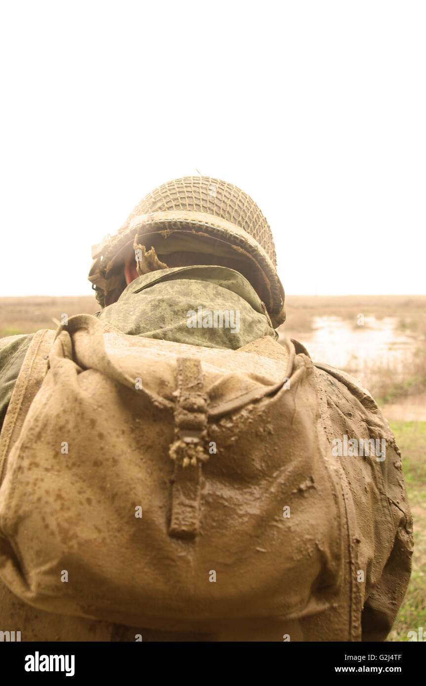 Soldier in Rain, Rear View Stock Photo - Alamy