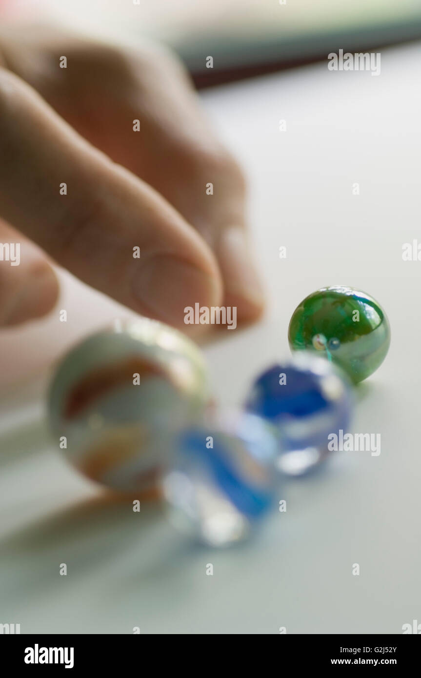 Playing with Marbles Stock Photo - Alamy