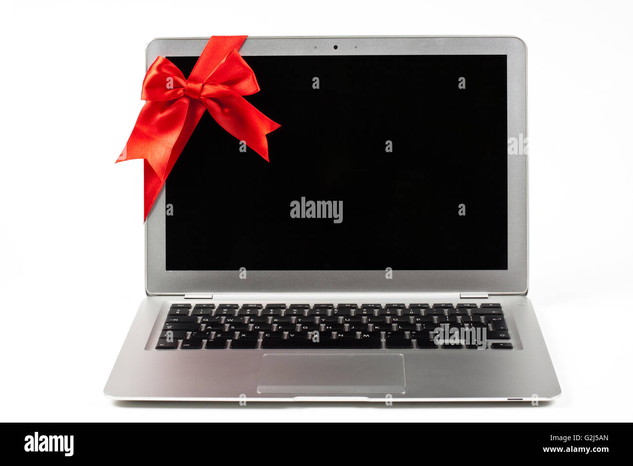 open silver laptop gift with red ribbon and black screen isolated on ...