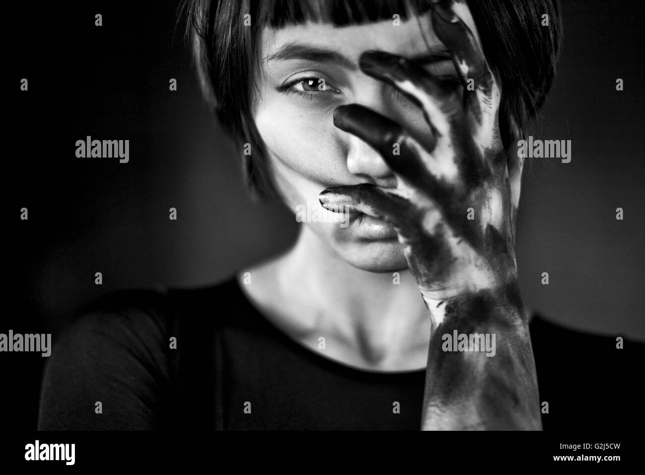 Young woman hands grabbing hair Black and White Stock Photos & Images ...