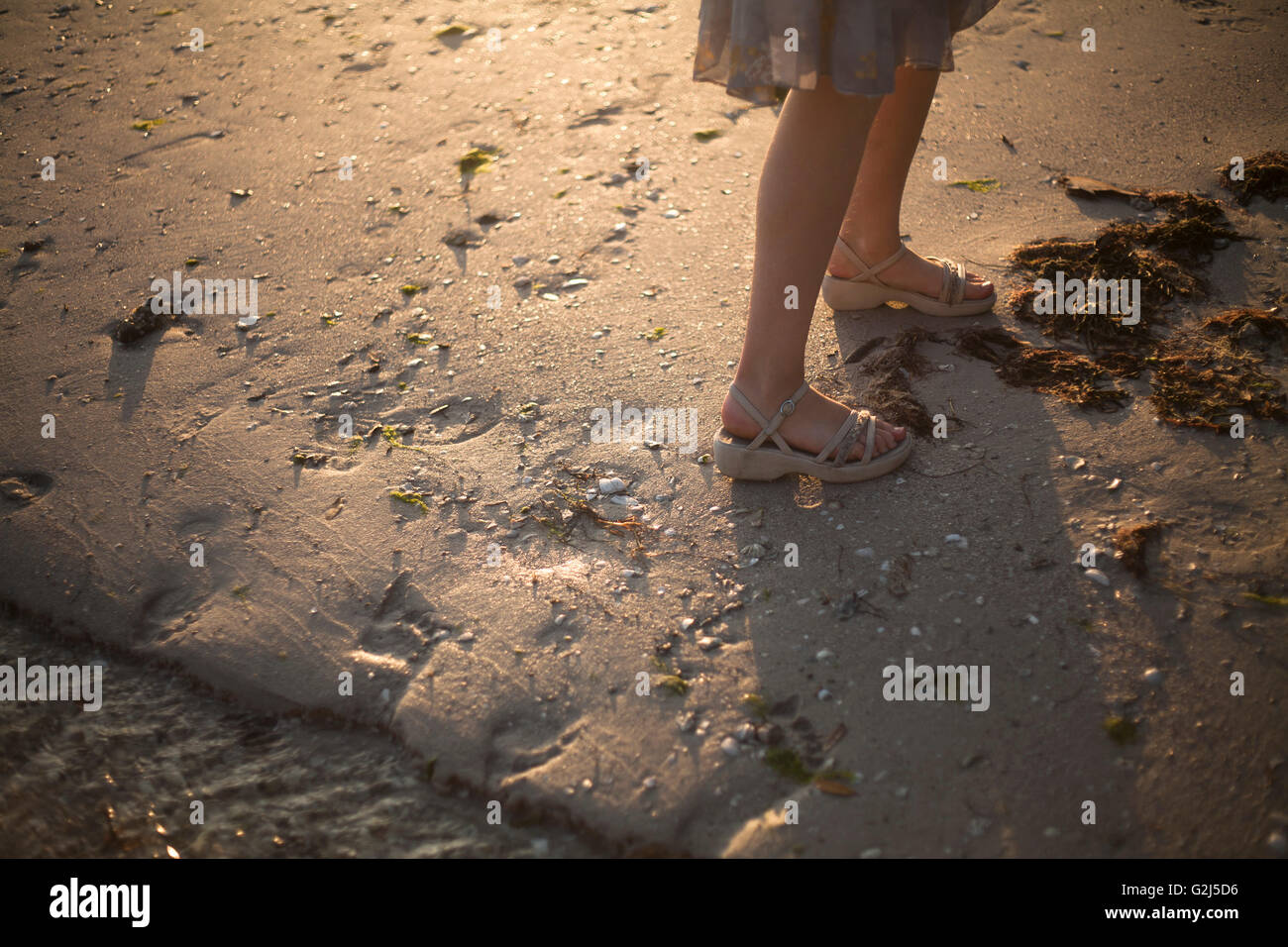 Woman's Feet Wearing Platform Sandals on Beach Sand Stock Photo - Alamy