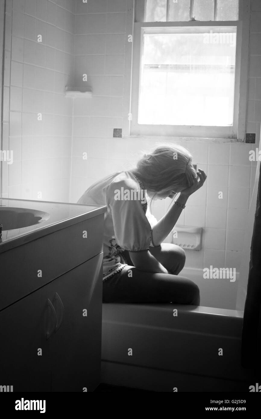 Depressed woman sitting Black and White Stock Photos & Images - Alamy