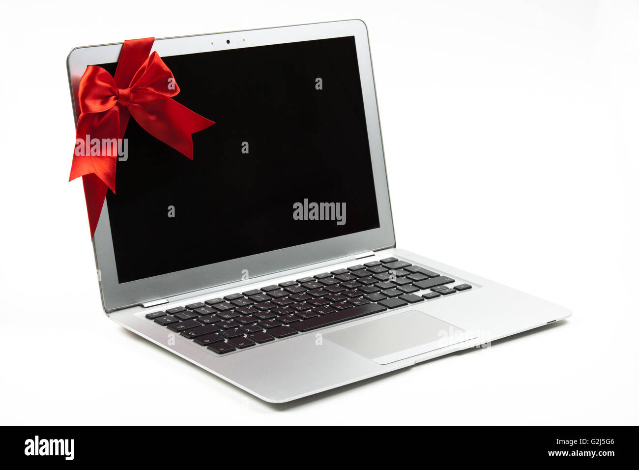 open silver laptop gift with red ribbon and black screen isolated on ...