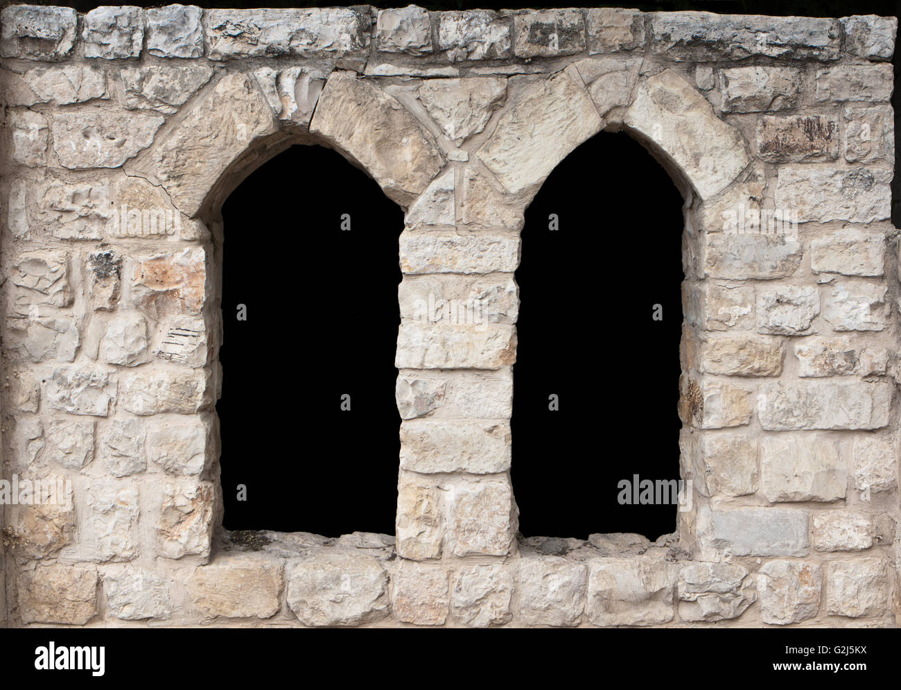 two ancient stone windows with arches and black filling Stock Photo - Alamy