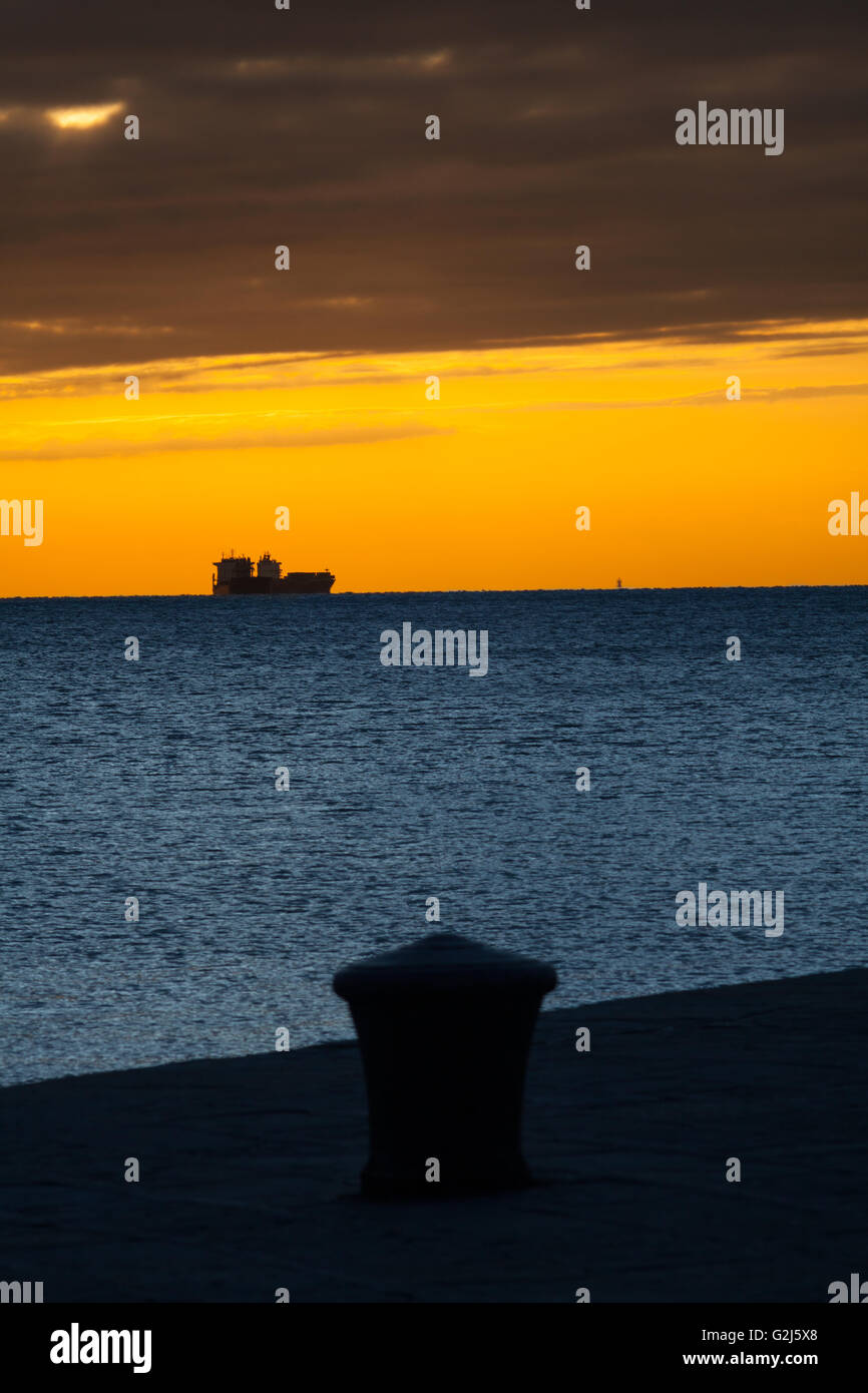 View ship in the Trieste sea at sunset Stock Photo - Alamy