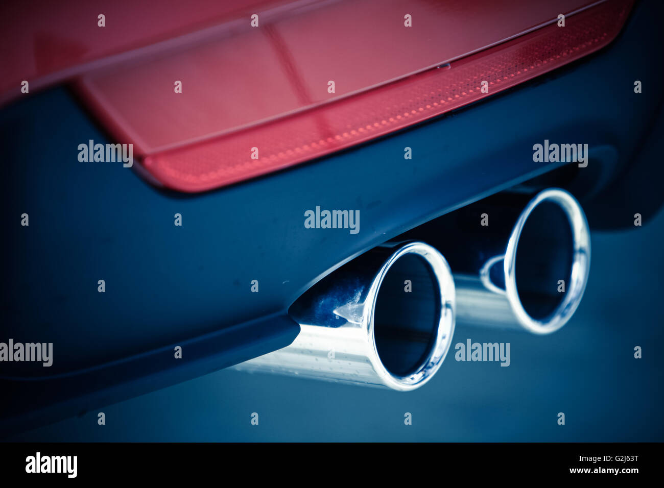 Detail of the double exhaust of a car Stock Photo - Alamy