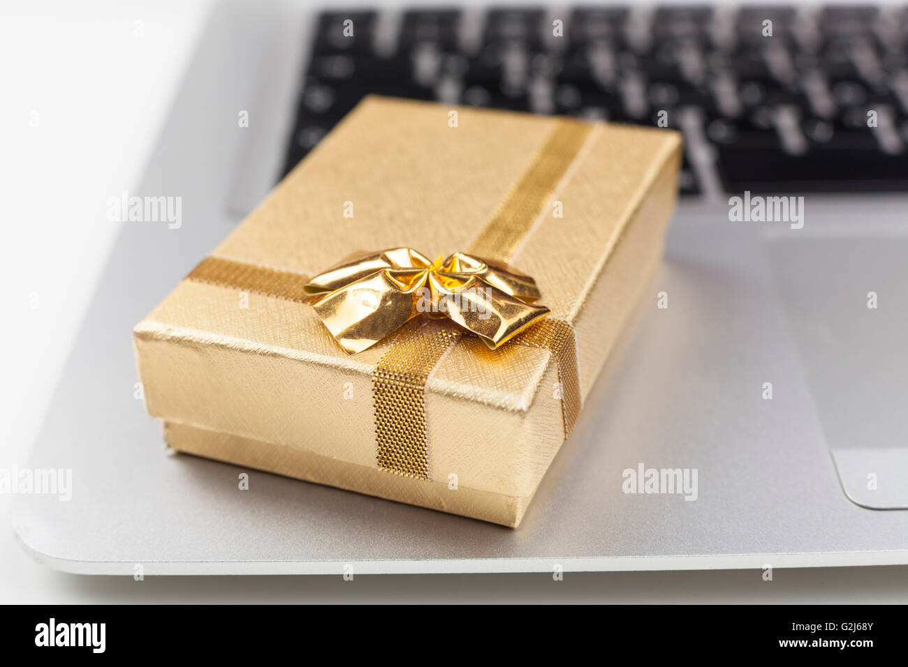 Gold gift box on hi-res stock photography and images - Alamy