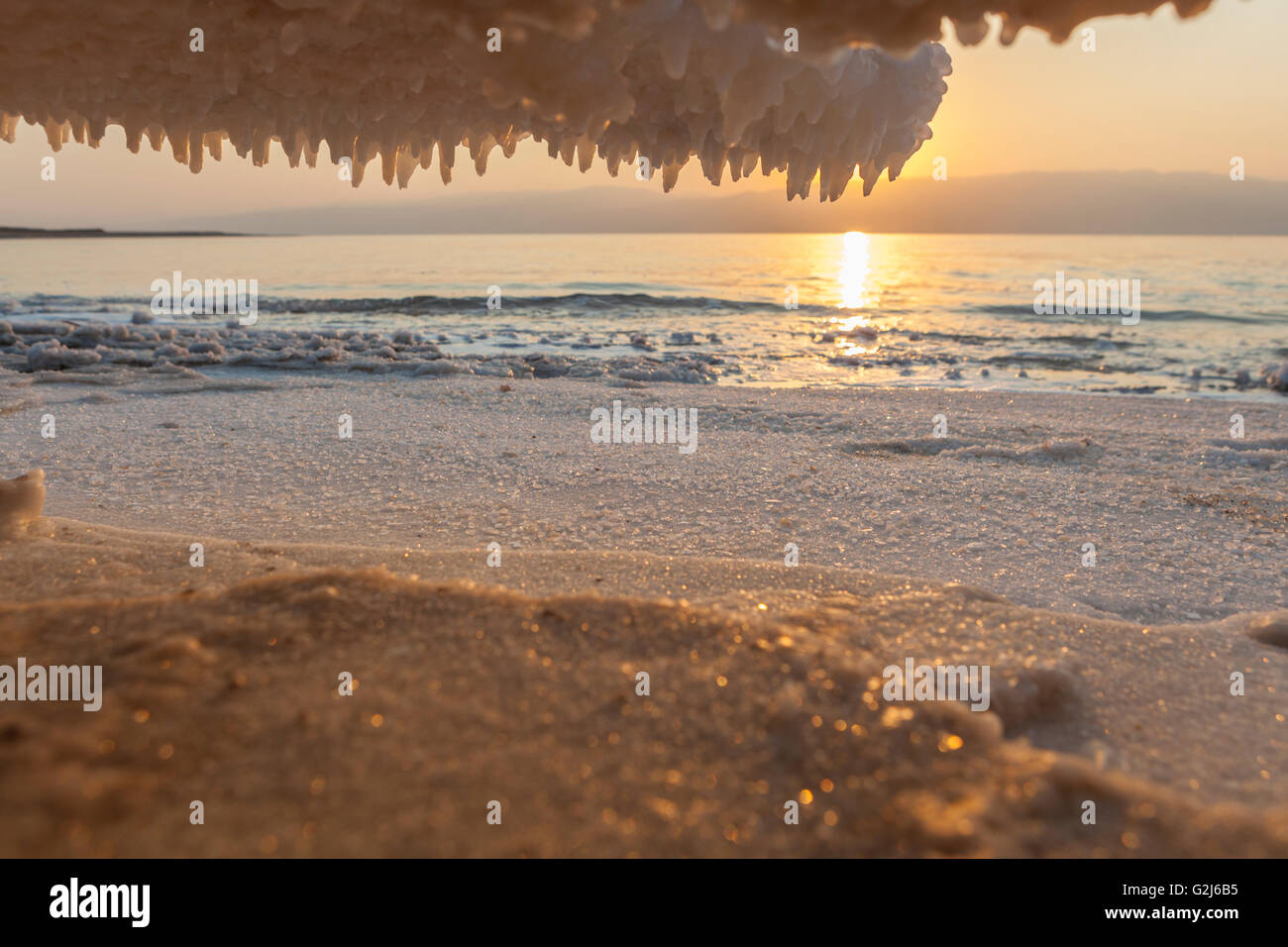 Salt Crystals formations all around on dead sea sunrise background ...
