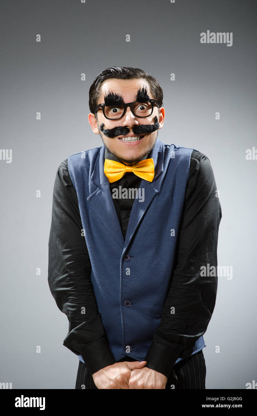 Funny man against dark background Stock Photo - Alamy