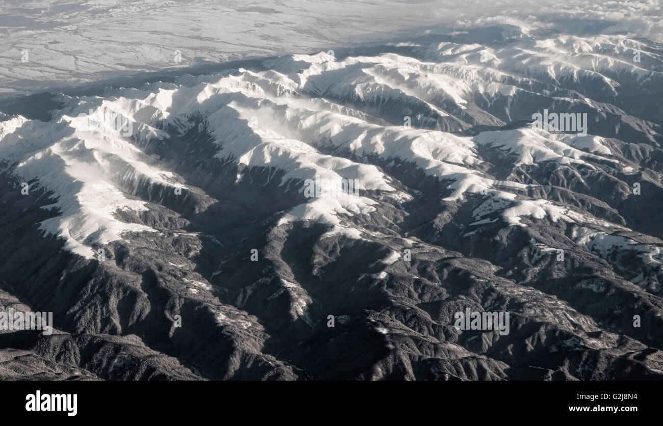 rocky mountains covered with snow aerial view Stock Photo - Alamy