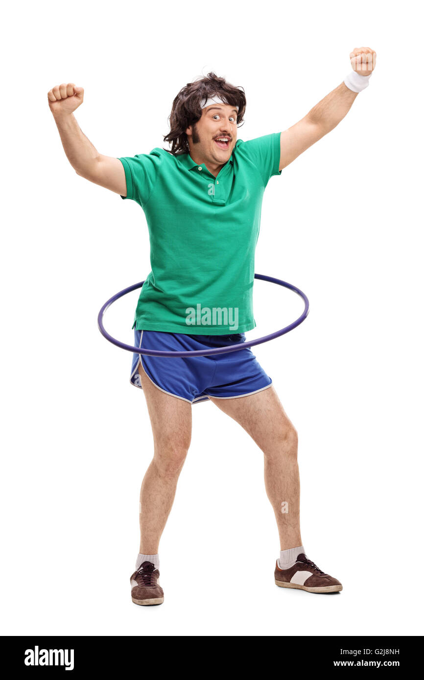 Full length portrait of a retro guy exercising with a hula hoop ...