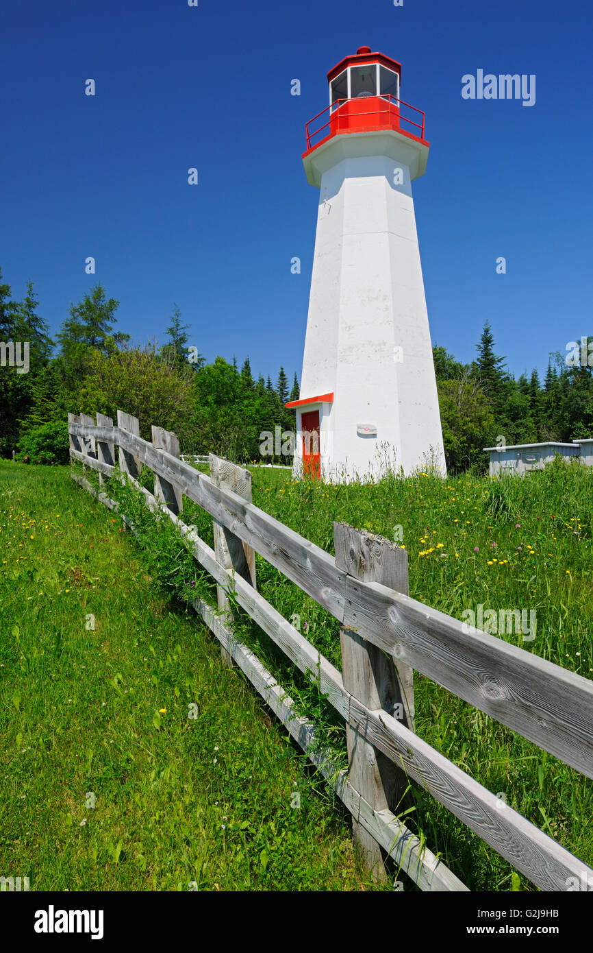 Lighthouse and fence on gulf of st lawrence hi-res stock photography ...
