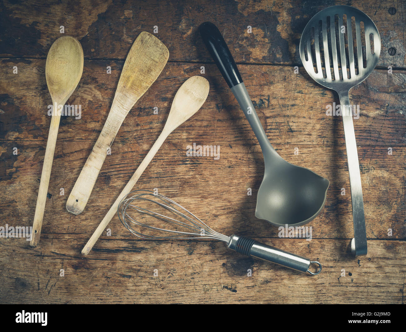 Overhead shot of a selection of spoons and other kitchen utensils on a ...