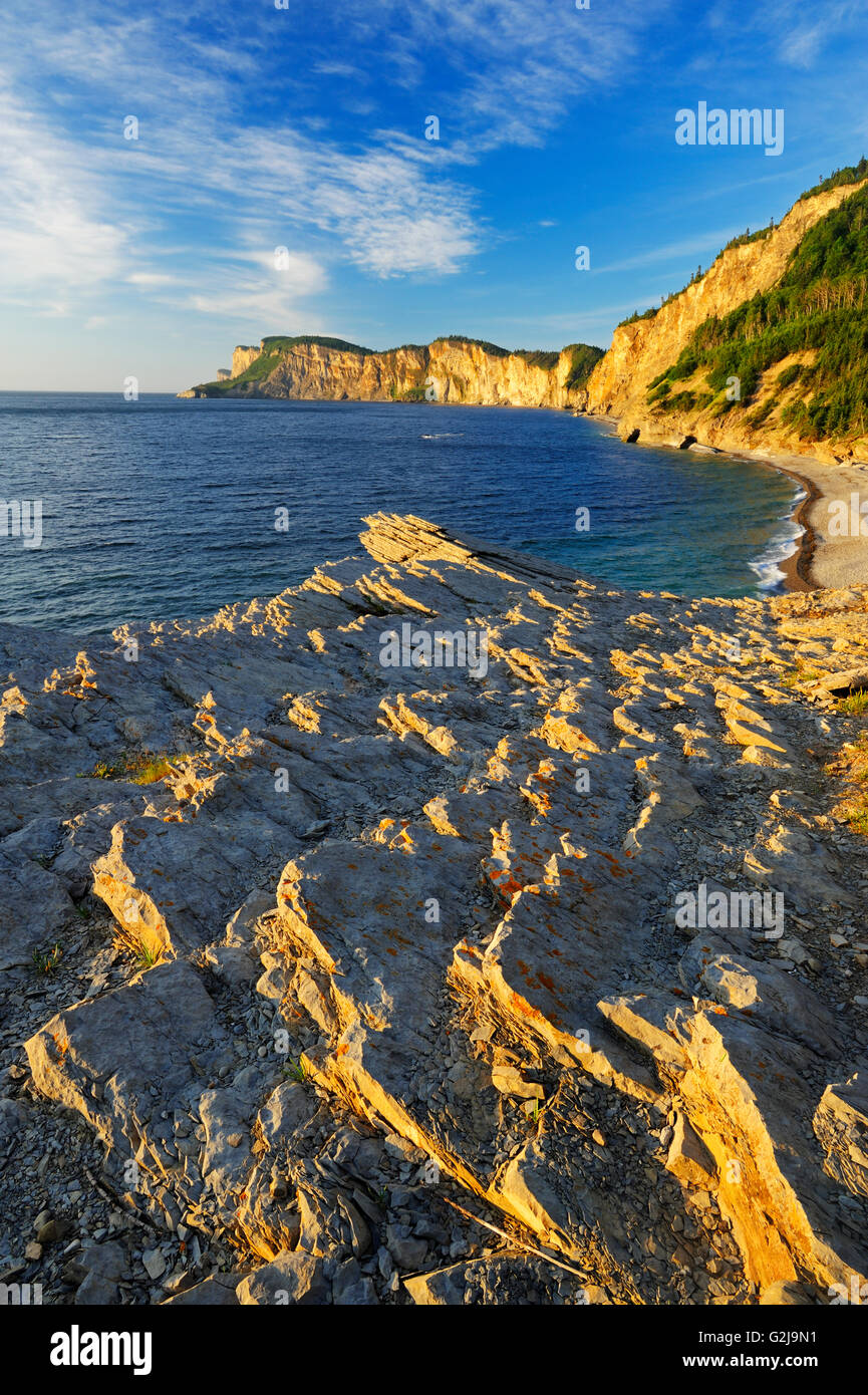 Limestone along the Atlantic shoreline at sunrise Forillon National ...