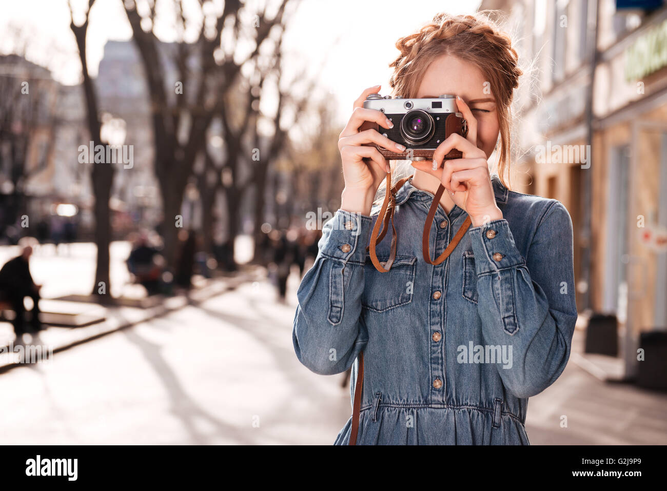 Woman taking pictures outdoors hi-res stock photography and images - Alamy