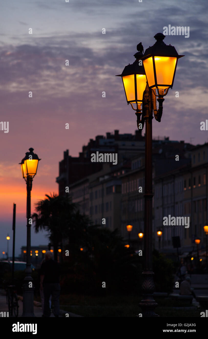 View of street lantern illuminated in Trieste, Italy Stock Photo - Alamy
