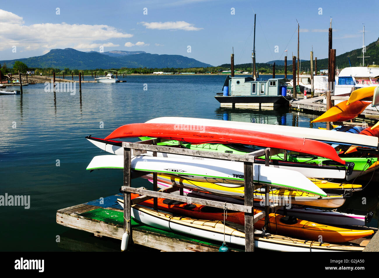 Stacked kayaks hi-res stock photography and images - Alamy