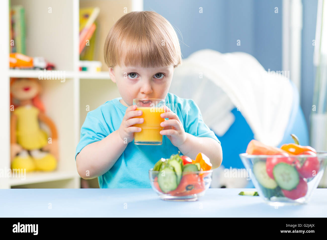 child boy drinking juice from glass indoors Stock Photo - Alamy