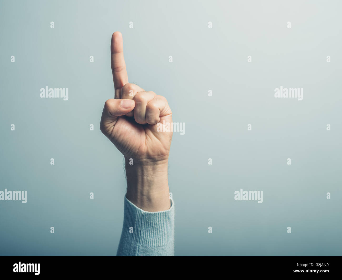 A male hand with the index finger pointing up Stock Photo - Alamy