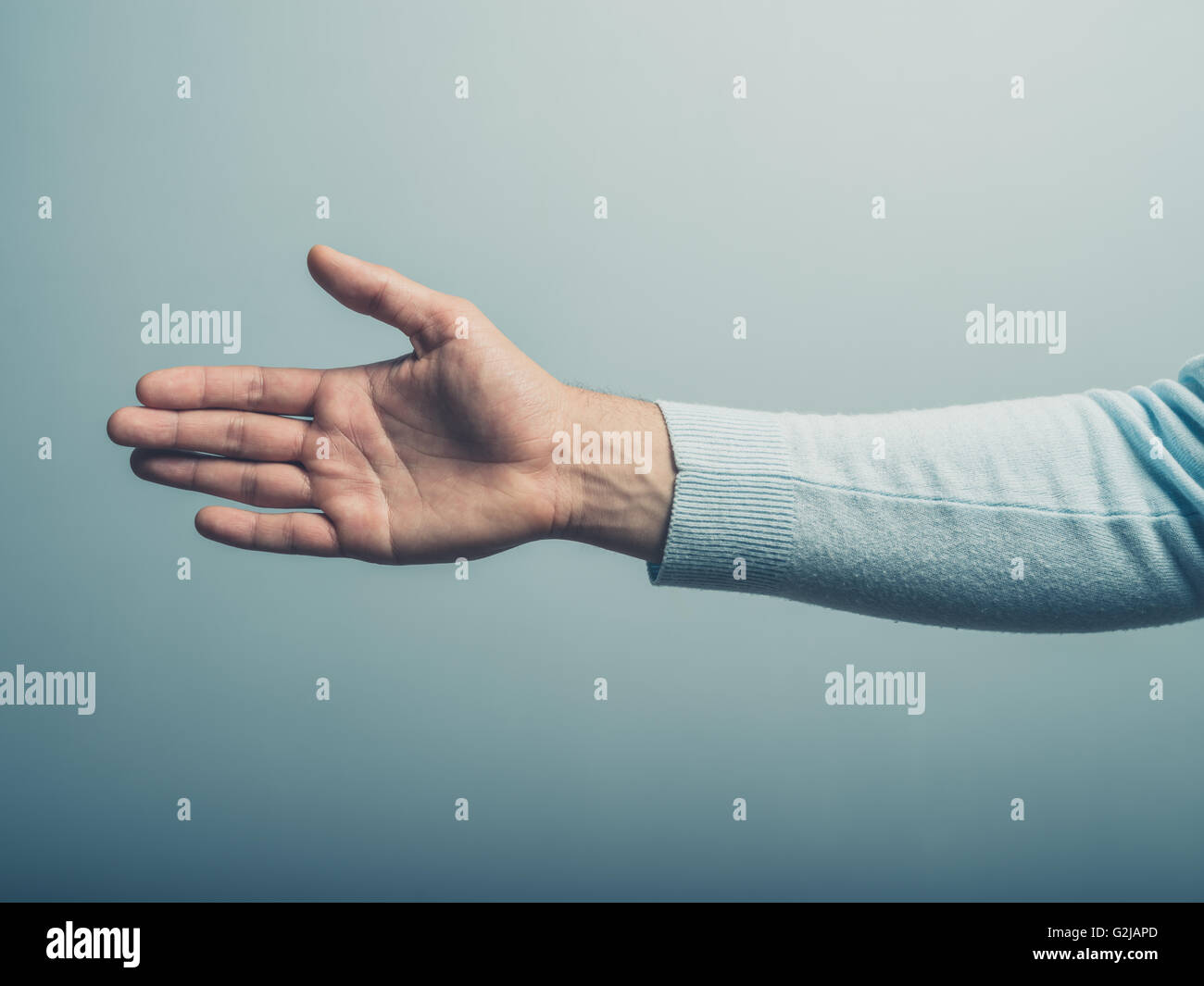 Young man offering hand handshake hi-res stock photography and images ...