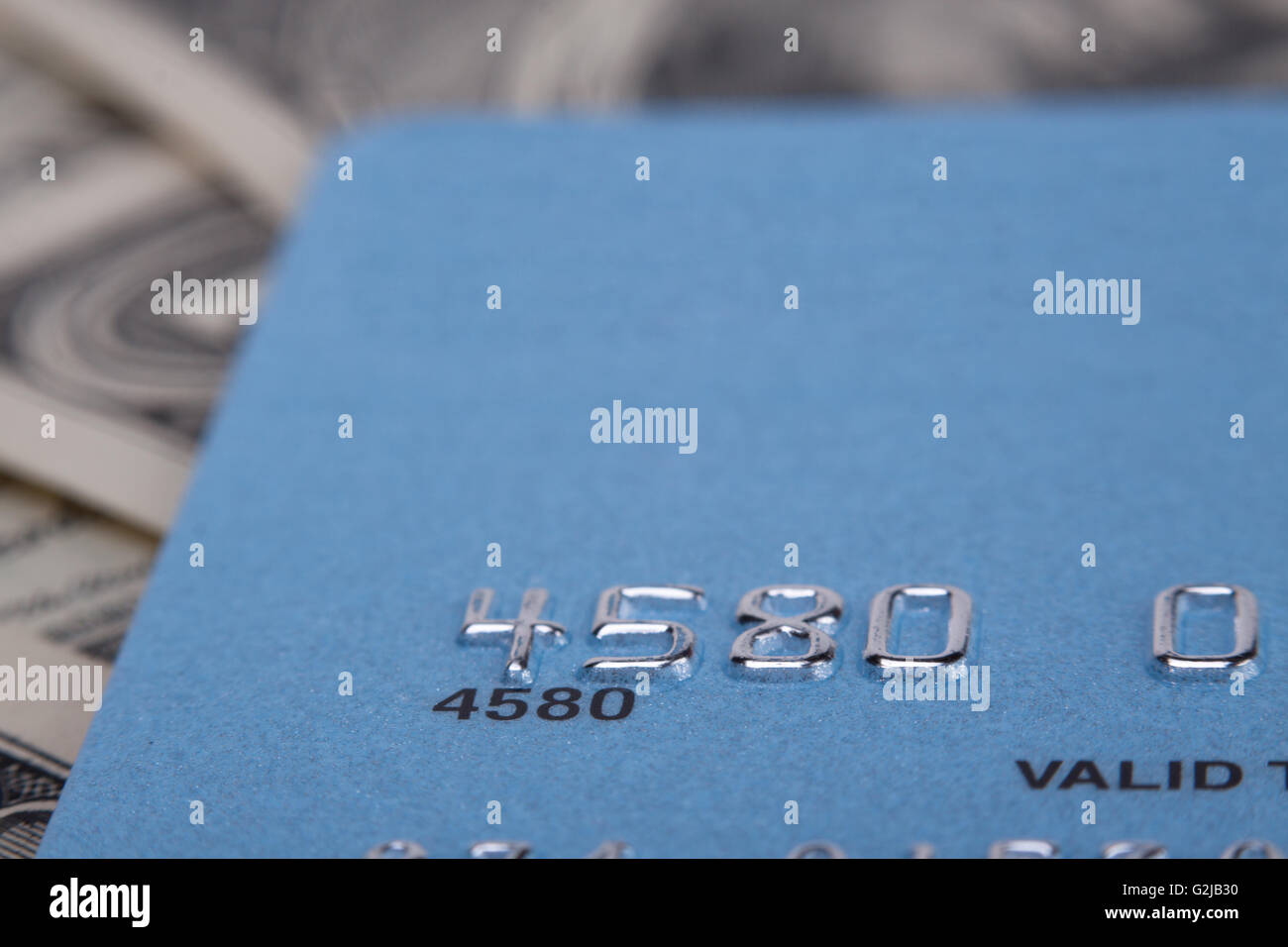 credit card numbers close-up on money background Stock Photo - Alamy