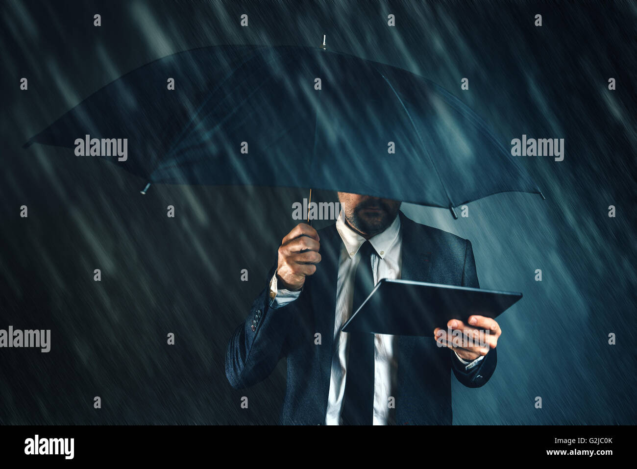Reading umbrella rain hi-res stock photography and images - Alamy