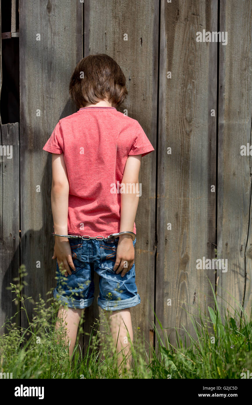 Child handcuffs hi-res stock photography and images - Alamy