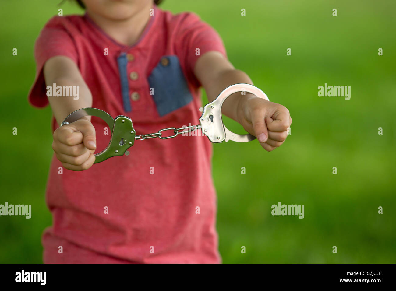 Handcuffs kid hi-res stock photography and images - Alamy