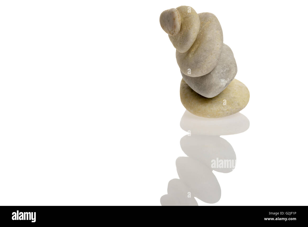 Five stones in balance with reflection in white background Stock Photo ...