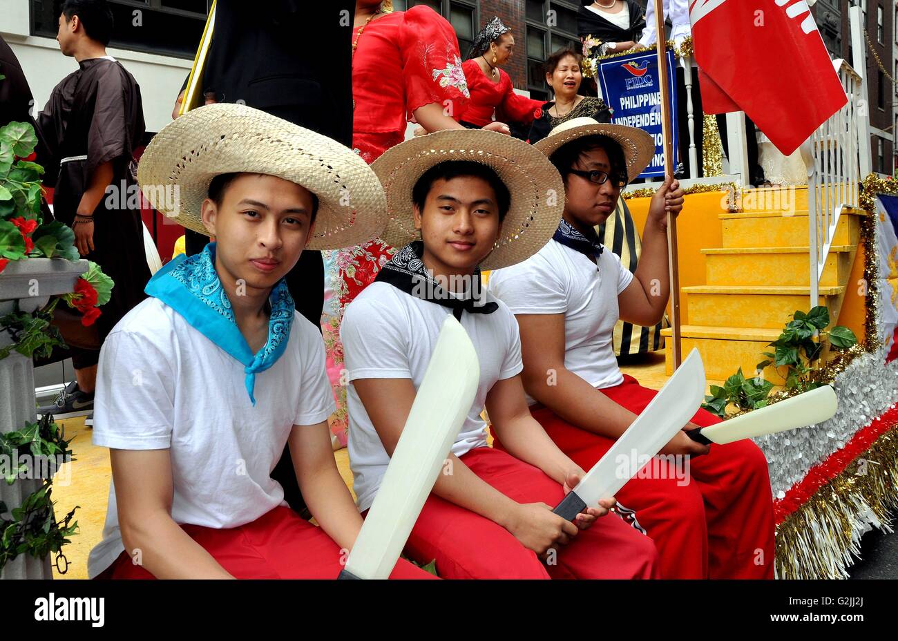 New York City: Filipino boys with machetes riding on a float at the ...